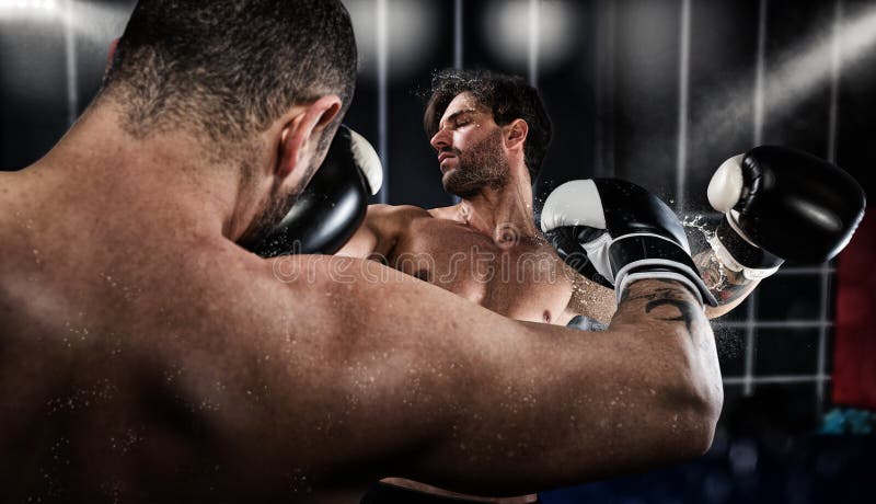 Boxer Punches His Opponent during Boxing Competition Stock Image ...
