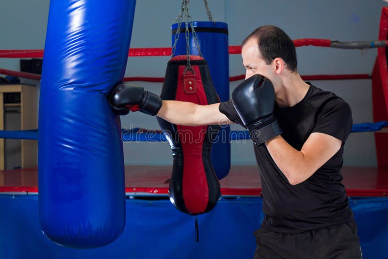 Boxer Punching a Sand Bag with Back Hand Stock Photo - Image of ...