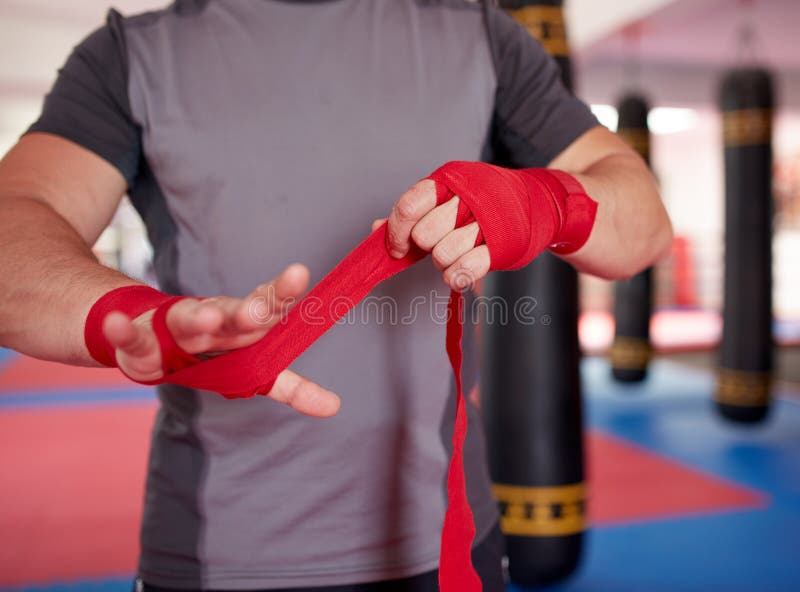 Boxer putting handwraps on stock photo. Image of sporty - 151864654