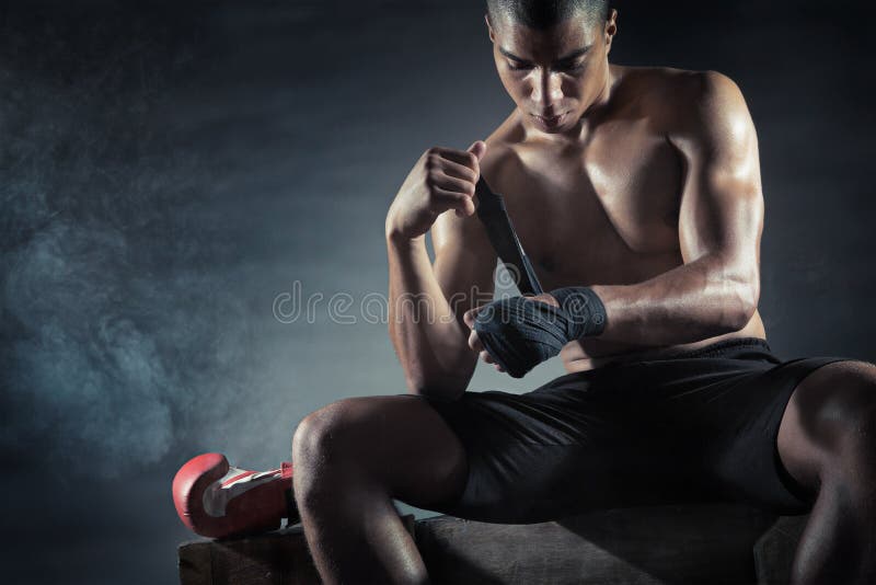 Tired Boxer Resting on the Ropes in Boxing Ring, Looking Up Stock Photo ...