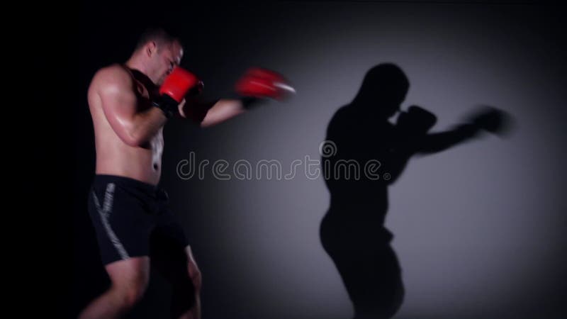 Boxer Training Shadow Boxing Over Black Background Stock Video - Video ...