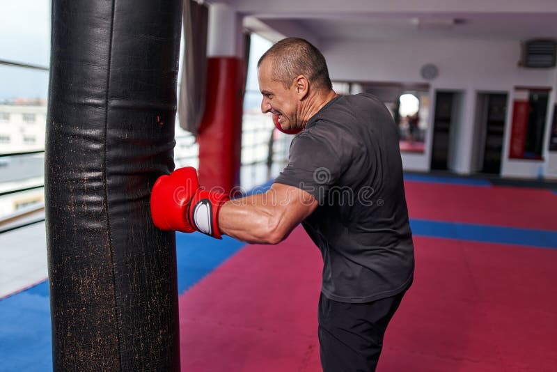 Boxer Working the Heavy Bag Stock Image - Image of mature, action ...