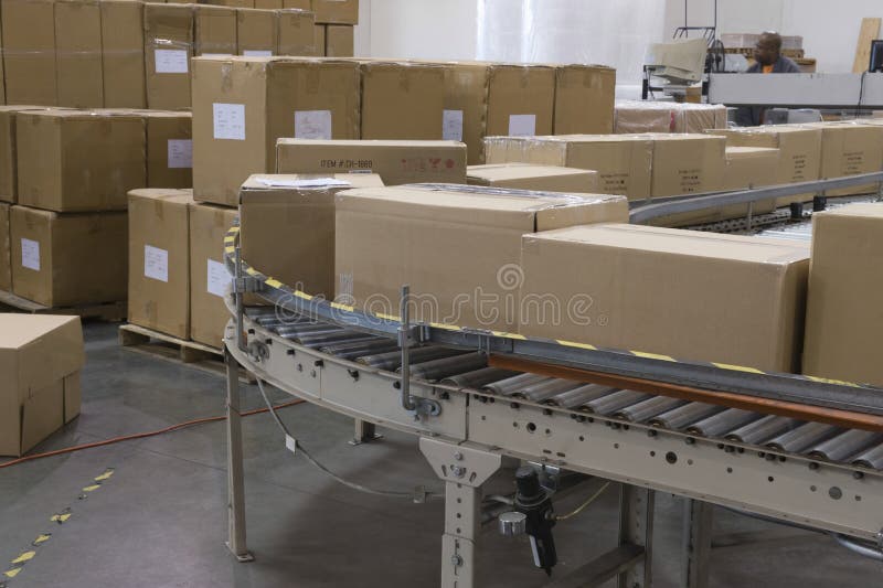 Boxes on Conveyor Belt in Warehouse Stock Photo - Image of horizontal ...