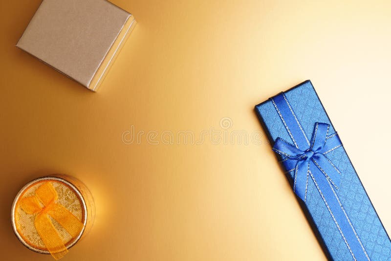 Boxes of Gifts of Small Size and Different Shapes Stand on a Golden ...