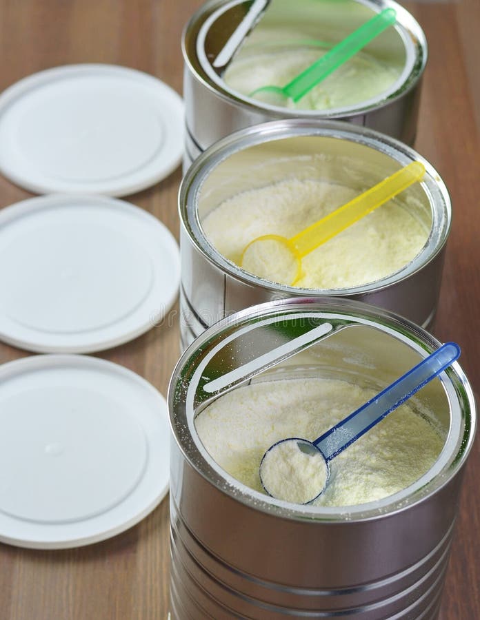 Boxes of Infant Milk with Scoops Stock Photo - Image of food, green ...