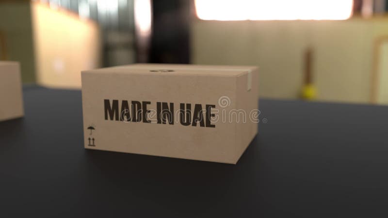 Boxes with MADE in UAE Text on Conveyor. United Arab Emirates Goods ...