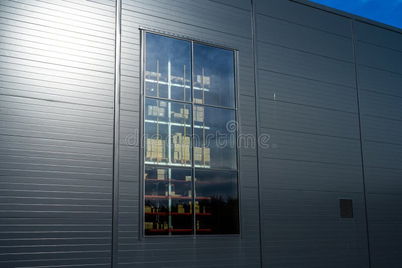 Boxes and Pallets Visible through a Window at a Large Warehouse.. Stock ...