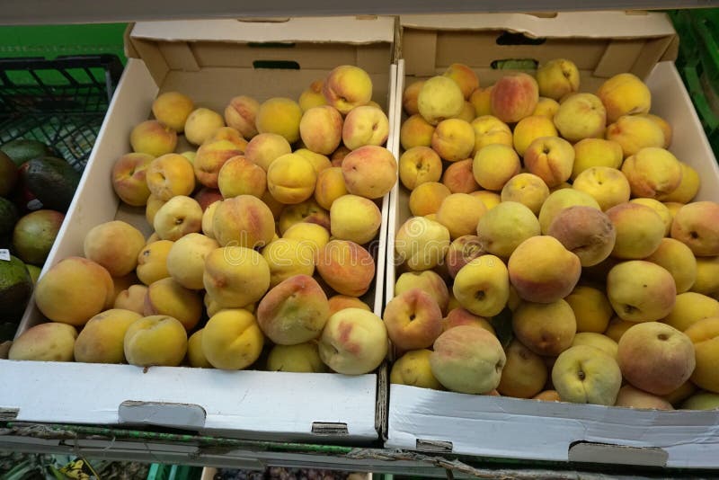Boxes of Peaches on the Shelf in the Store Stock Photo - Image of logo ...