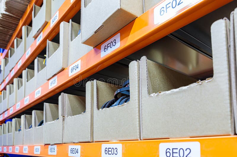 Boxes on Racks in a Warehouse of Goods Close-up. Stock Image - Image of ...