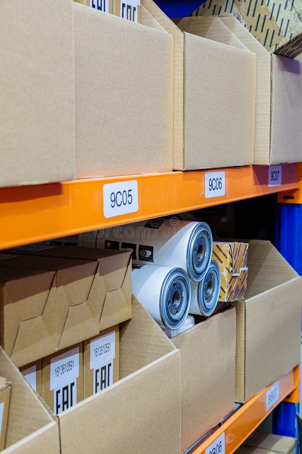 Boxes on Racks in a Warehouse of Goods Close-up. Stock Photo - Image of ...