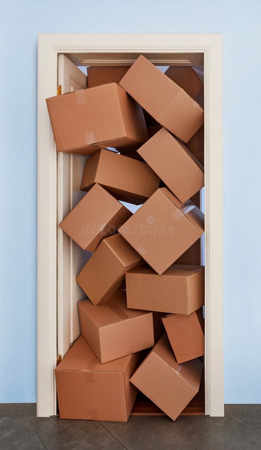 Boxes stuck in the doorway stock photo. Image of manufactured - 210762712