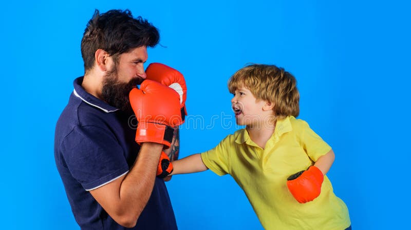 Boxing Coach and Kid Training. Child in Gloves Learning Boxing. Father ...