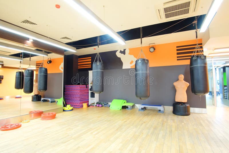 In the Boxing Hall, an Experienced Trainer Teaches a Young Girl the ...