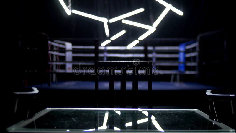 Boxing Ring and Two Chairs with Table Dark Background. View of a ...