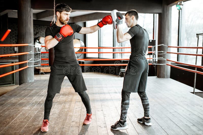 Boxing Trainer with a Man Boxing at the Gym Stock Photo - Image of ring ...