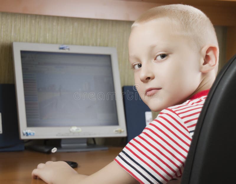 Boy using computer at home stock image. Image of computers - 34411323
