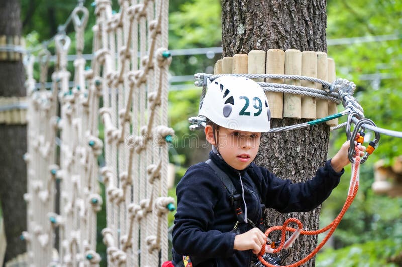 Boy in adventure park stock photo. Image of pulley, happy - 46091222