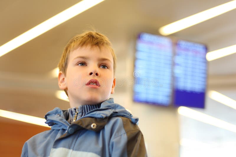 Boy in Airport Looking into Distance Stock Photo - Image of screen ...