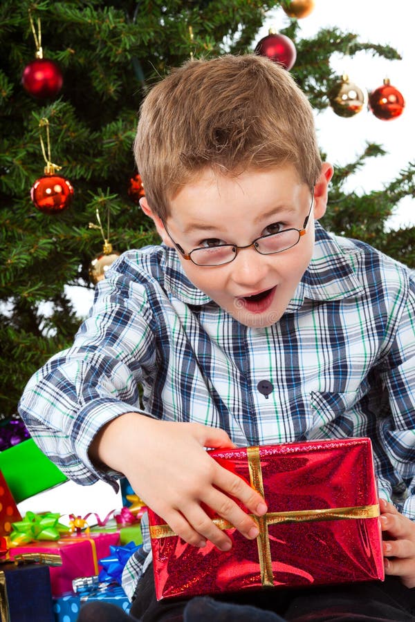 Boy Amazed of the Content of His Christmas Gift Stock Image - Image of ...