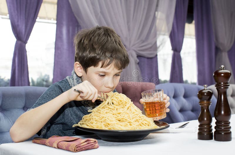 Boy is Appetizing Eats a Large Italian Spaghetti Stock Image - Image of ...