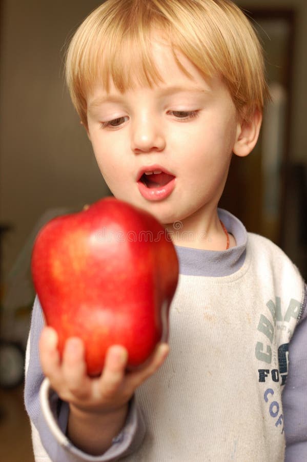 Boy with an apple stock photo. Image of happy, juicy, caucasian - 7513530