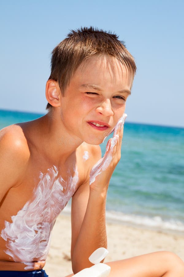 Boy with sunscreen on face stock image. Image of summer - 50896707