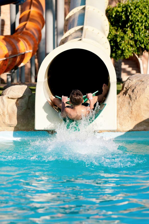Young People Having Fun on Water Slides in Aqua Park Stock Photo ...