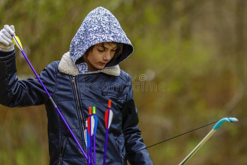 Boy Archer Shooting with His Bow at an Outdoor Stock Image - Image of ...