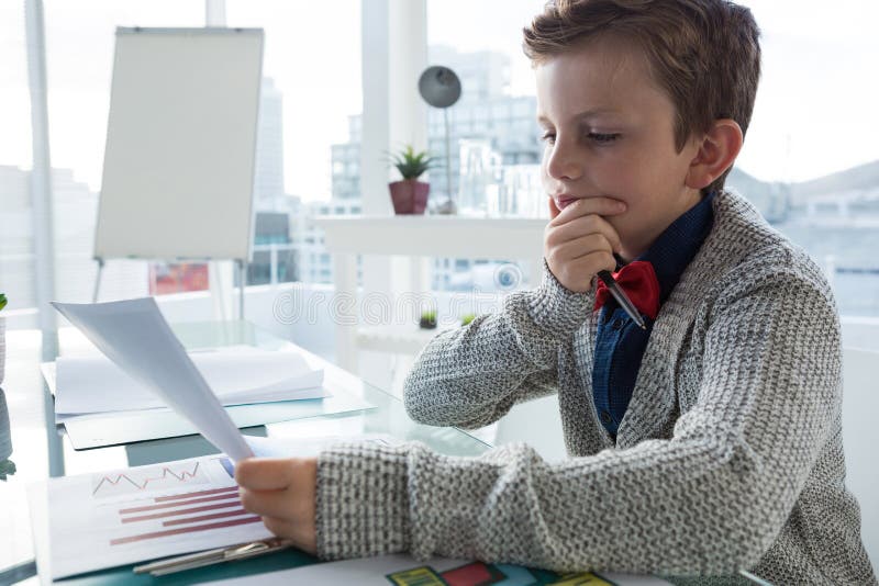 Boy As Business Executive Verifying Document Stock Image - Image of ...