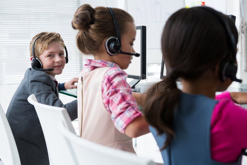 Boy As Customer Care Executive Smiling while Working in the Office ...