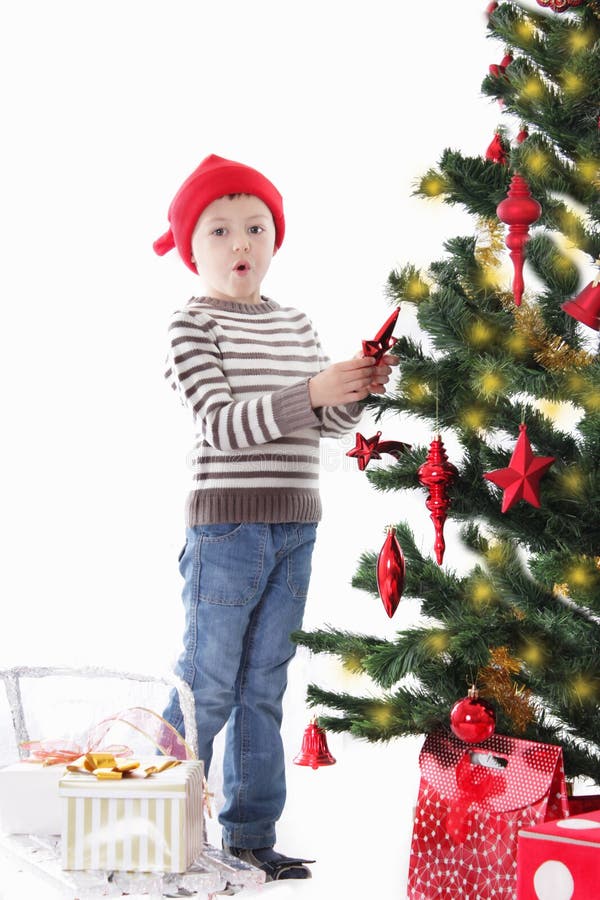 Boy As Santa Helper Decorating Christmas Tree Stock Image - Image of ...