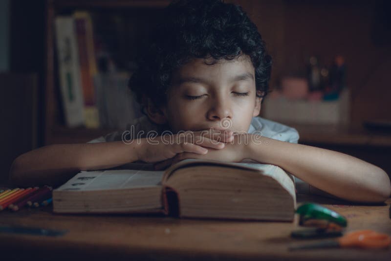 Boy Asleep on a Notebook in a Boring Class Stock Photo - Image of male ...