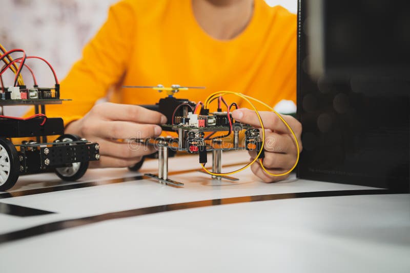 Boy Assembles a Programmable Self-propelled Toy Stock Image - Image of ...