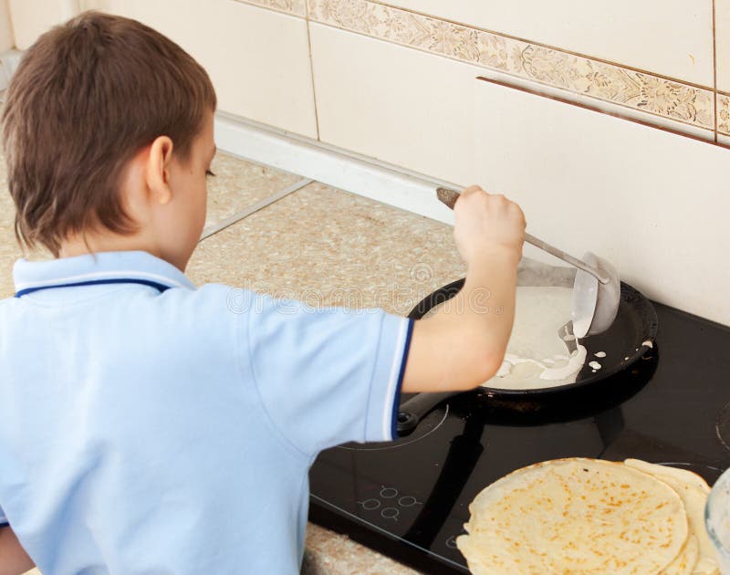 Boy bakes pancakes stock image. Image of child, crepes - 36810769