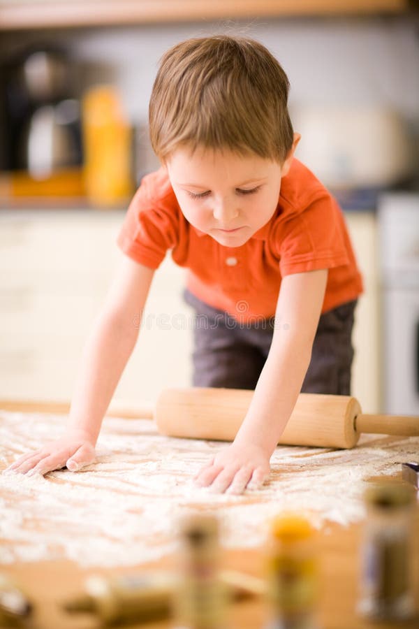 Boy baking cookies stock image. Image of indoors, tasty - 8317433