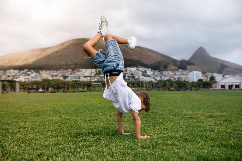 Boy playing in the ground stock image. Image of stand - 112823087