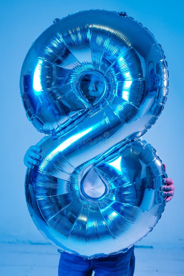 Boy with a Balloon in the Form of the Number Eight Stock Photo - Image ...