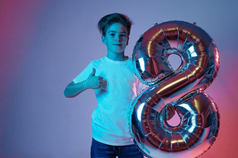Boy with Balloons in the Form of the Number Eight Stock Image - Image ...