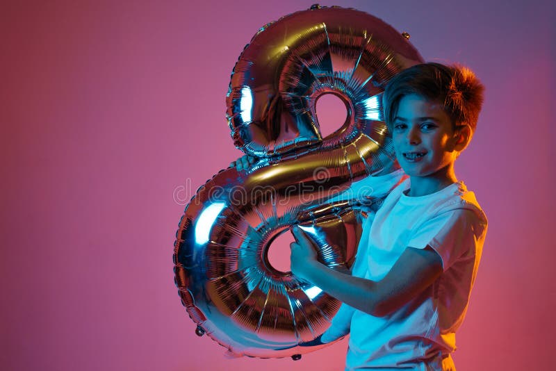 Boy with Balloons in the Form of the Number Eight Stock Image - Image ...