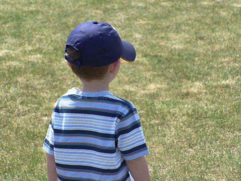 A boy in a baseball cap stock image. Image of preschooler - 19381299