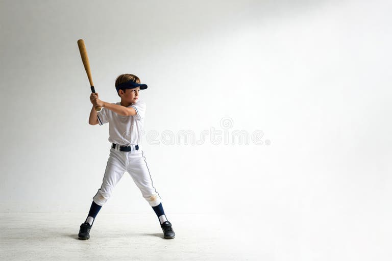 A Boy in a Baseball Uniform with a Bat Prepares To Strike. Space for Text. Stock Photo - Image ...