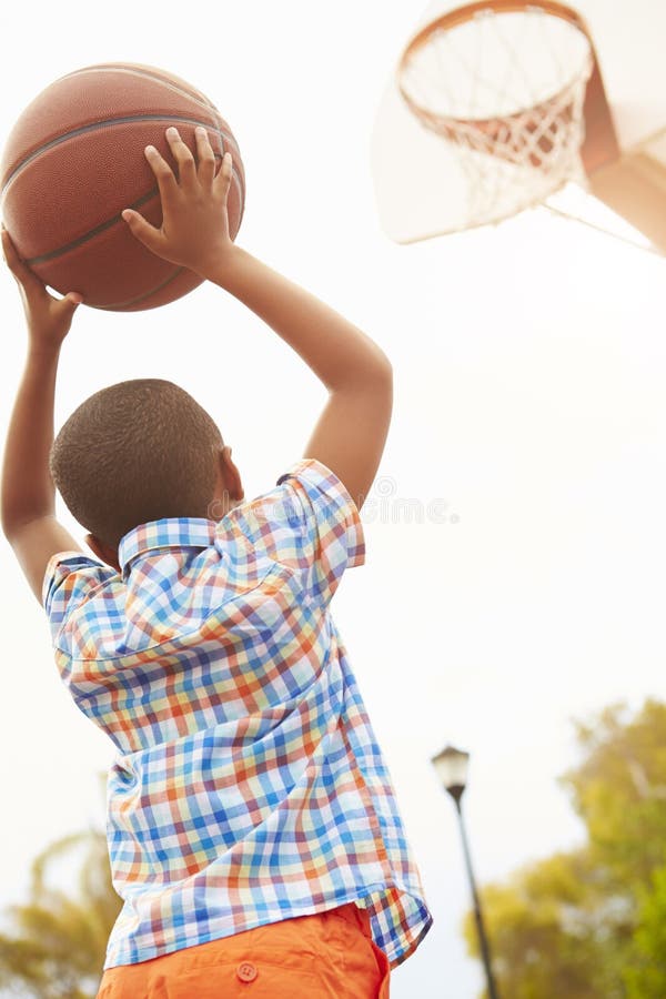 Boy on Basketball Court Shooting for Basket Stock Image - Image of ...