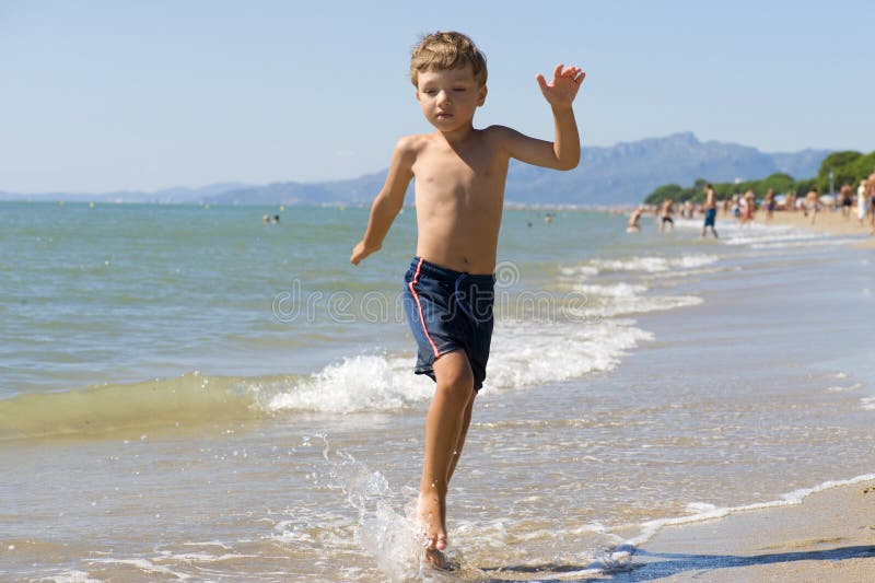 Boy on beach stock image. Image of male, child, face - 17553107