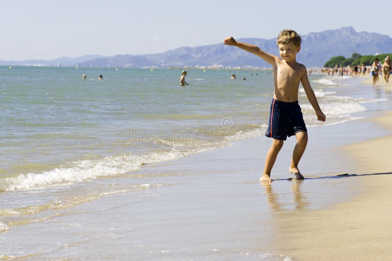Boy on the beach stock image. Image of blue, young, activity - 17553119