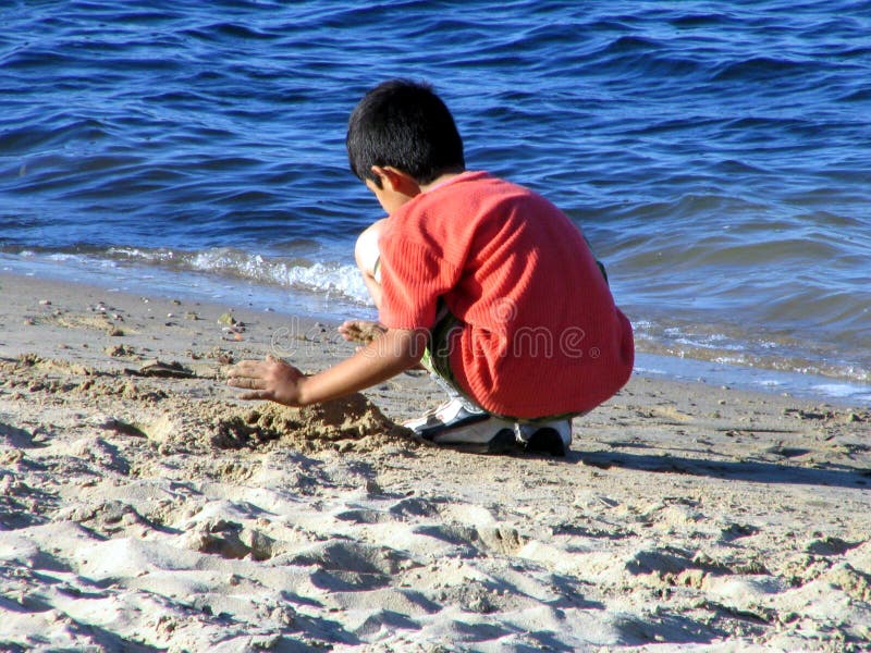 Boy at the Beach stock image. Image of sand, white, sunny - 418015