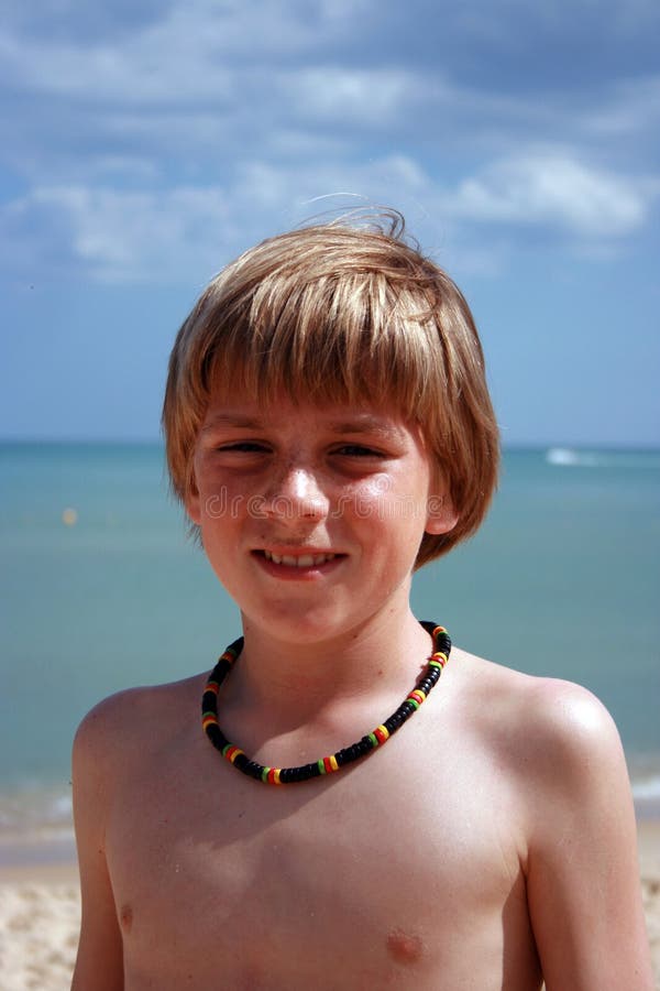 Boy on a beach stock photo. Image of nice, beach, water - 9464014