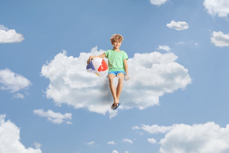 Boy with a Beach Ball Sitting on a Cloud Stock Photo - Image of ...