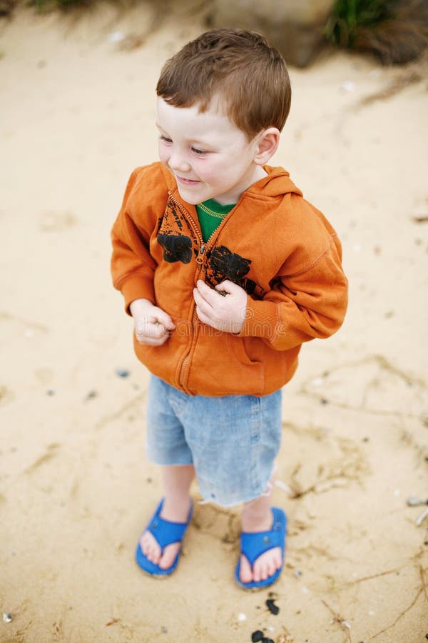 Boy at the Beach stock photo. Image of rocks, ocean, playing - 63485212
