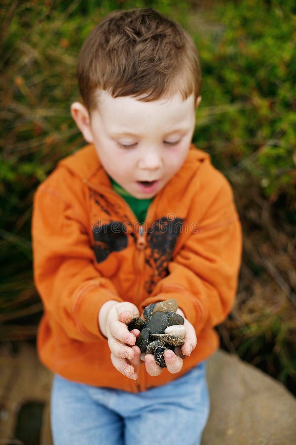 Child Collecting Rocks Stock Photos - Free & Royalty-Free Stock Photos ...