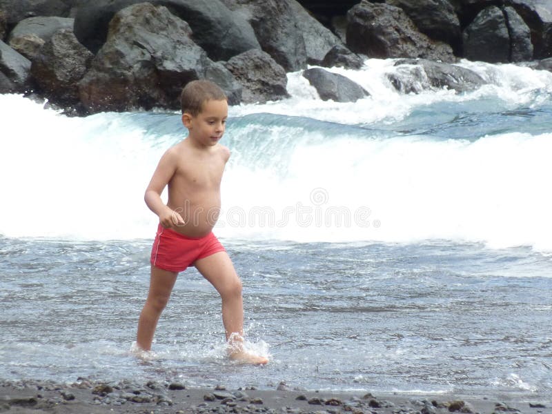 Boy at the Beach Shore Playing with Waves Stock Image - Image of child ...